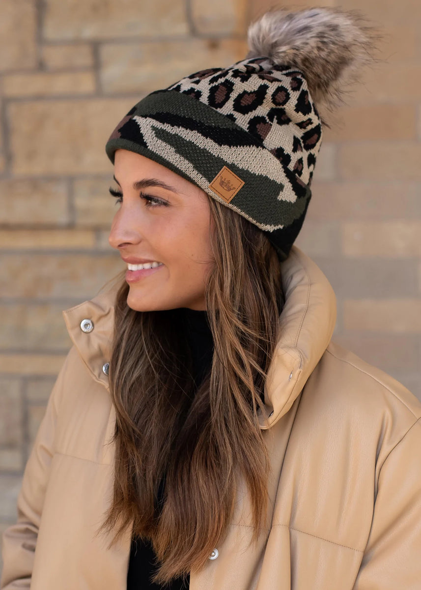 Leopard print knit hat Camo print trim Natural faux fur pom accent ...